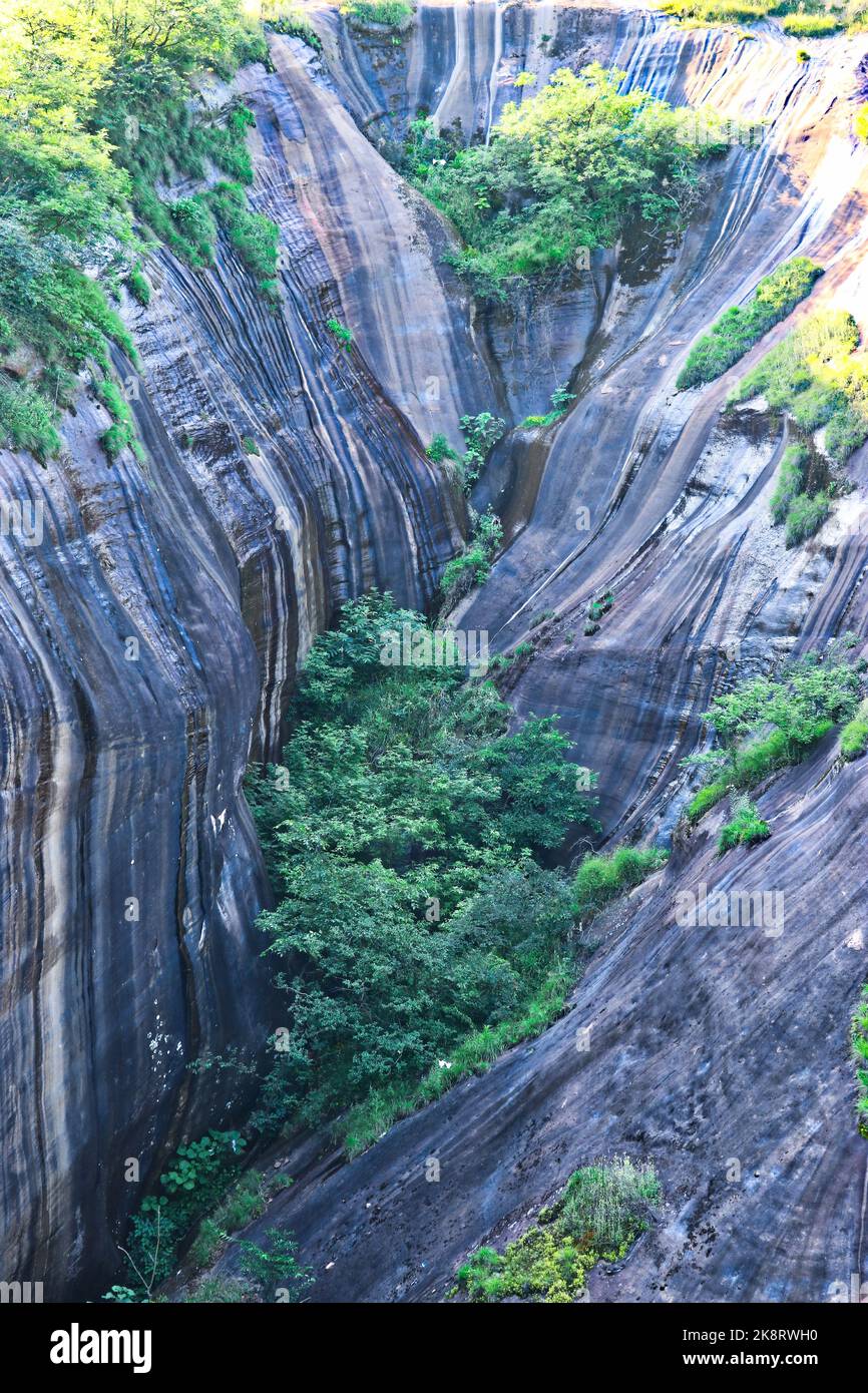 An aerial view of scenic rocky Gaoyi Ridge with scattered green ...