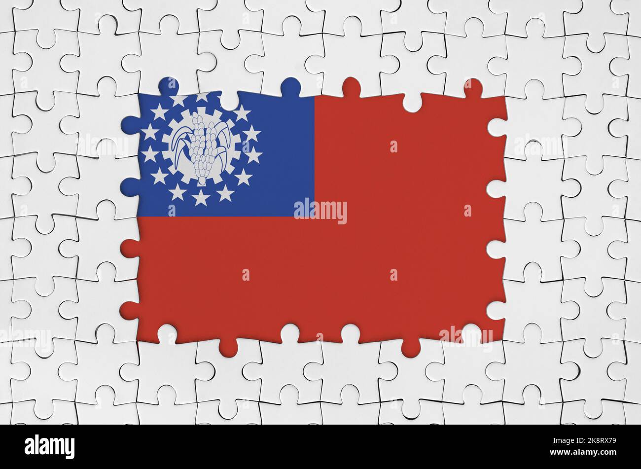 Myanmar flag in frame of white puzzle pieces with missing central parts ...