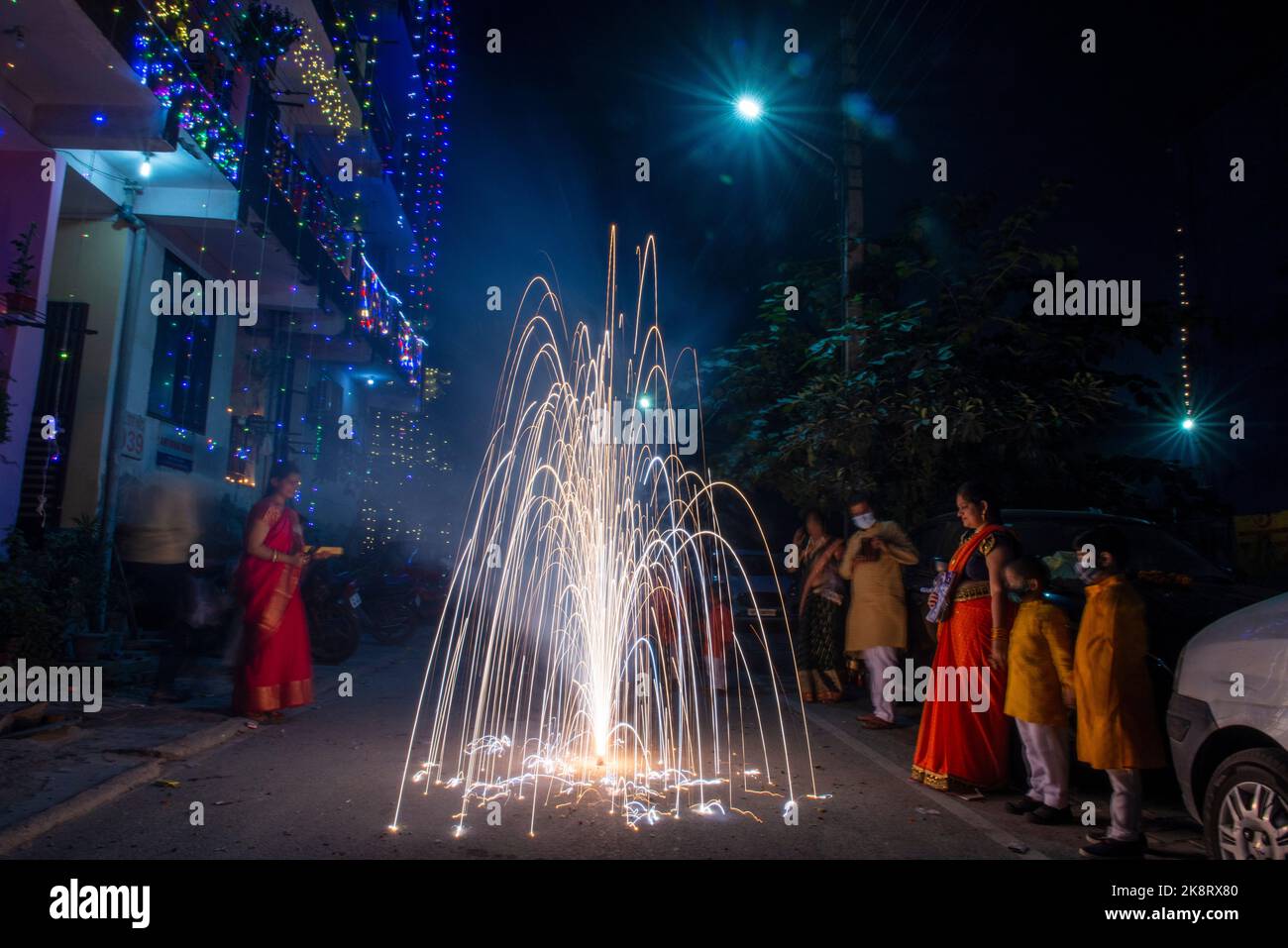 Ghaziabad, India. 24th Oct, 2022. People seen burning fountain crackers ...