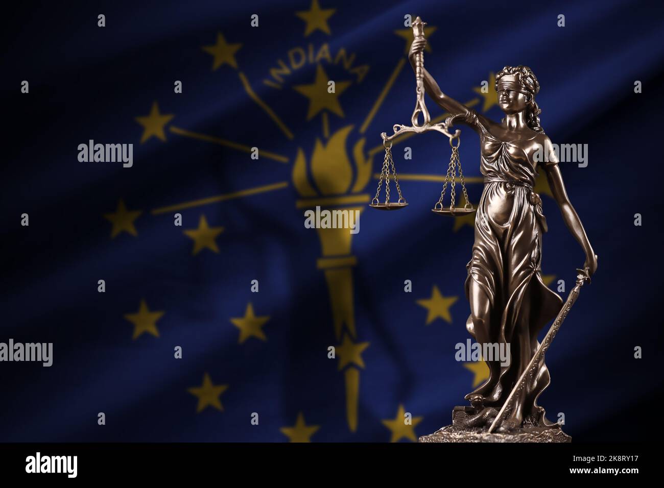 Indiana US state flag with statue of lady justice and judicial scales ...