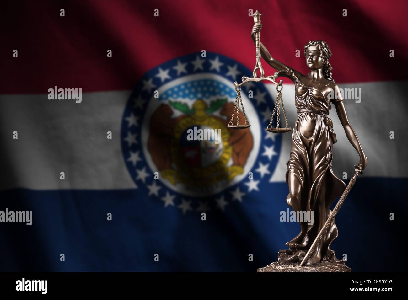 Missouri US state flag with statue of lady justice and judicial scales ...