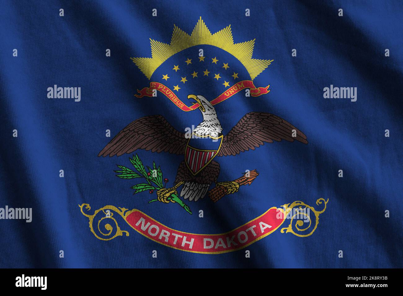 North Dakota US state flag with big folds waving close up under the ...