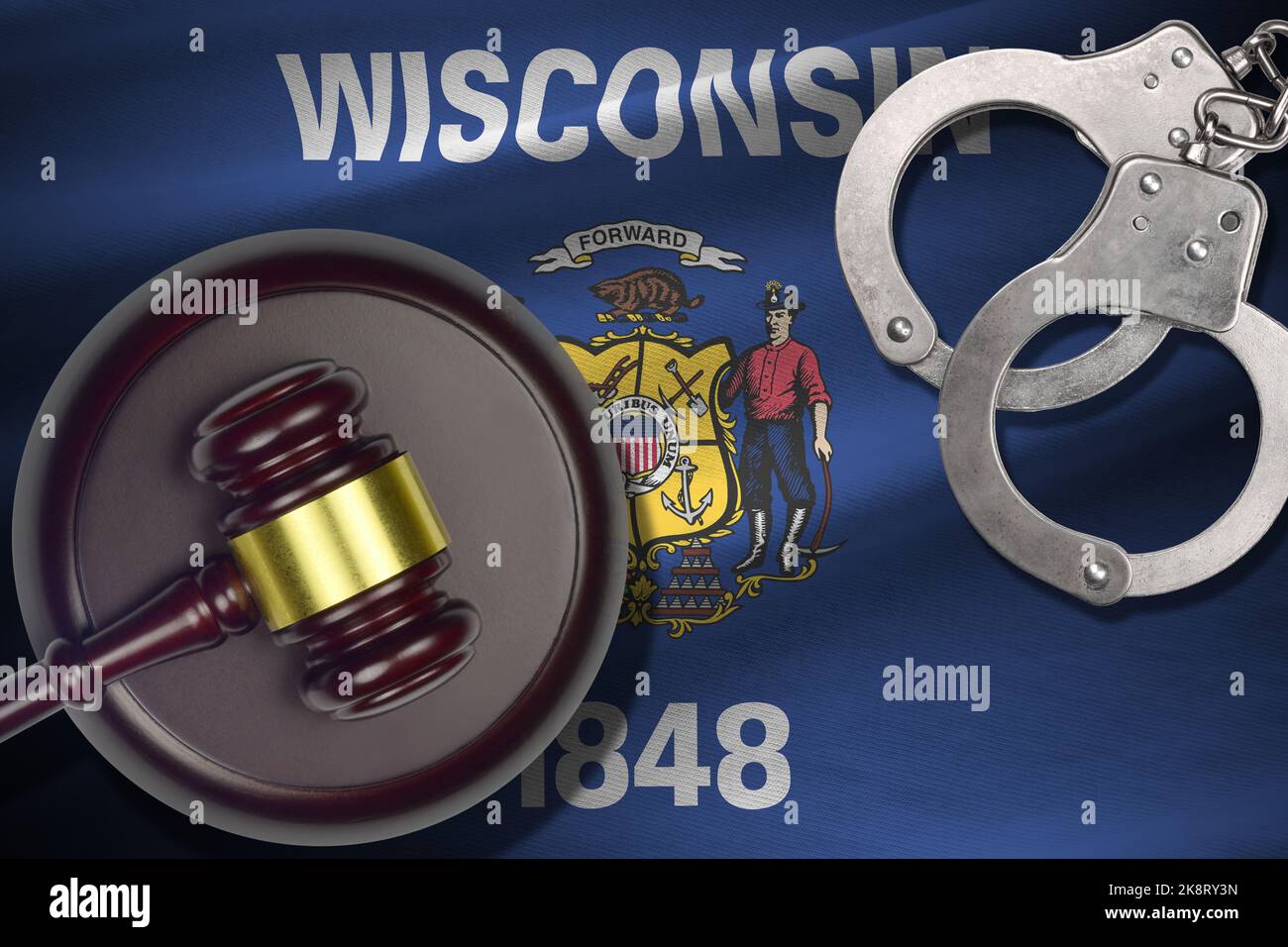 Wisconsin US state flag with judge mallet and handcuffs in dark room ...