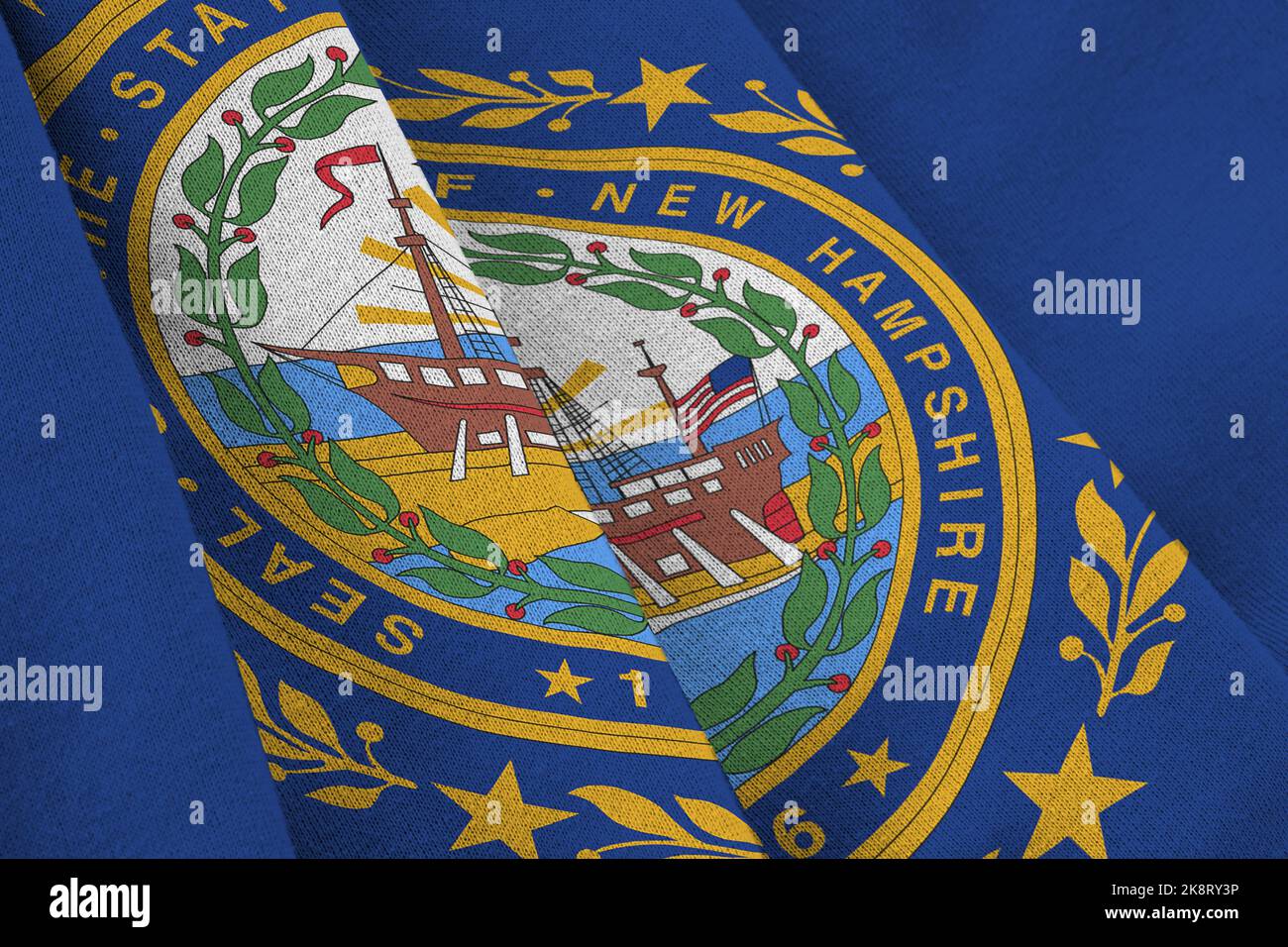 New Hampshire US state flag with big folds waving close up under the ...