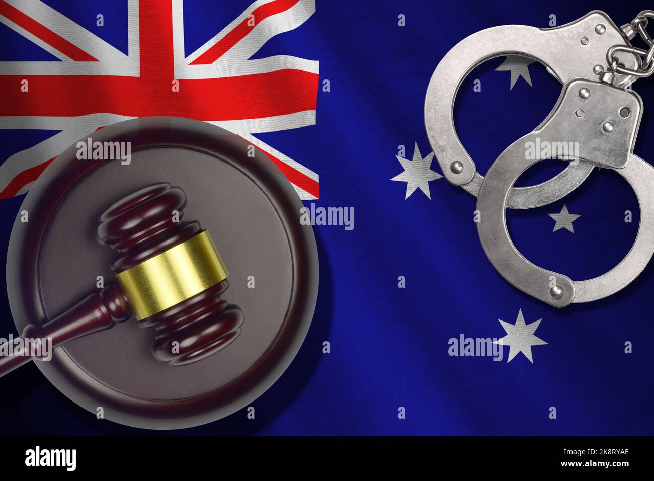 Australia flag with judge mallet and handcuffs in dark room. Concept of ...