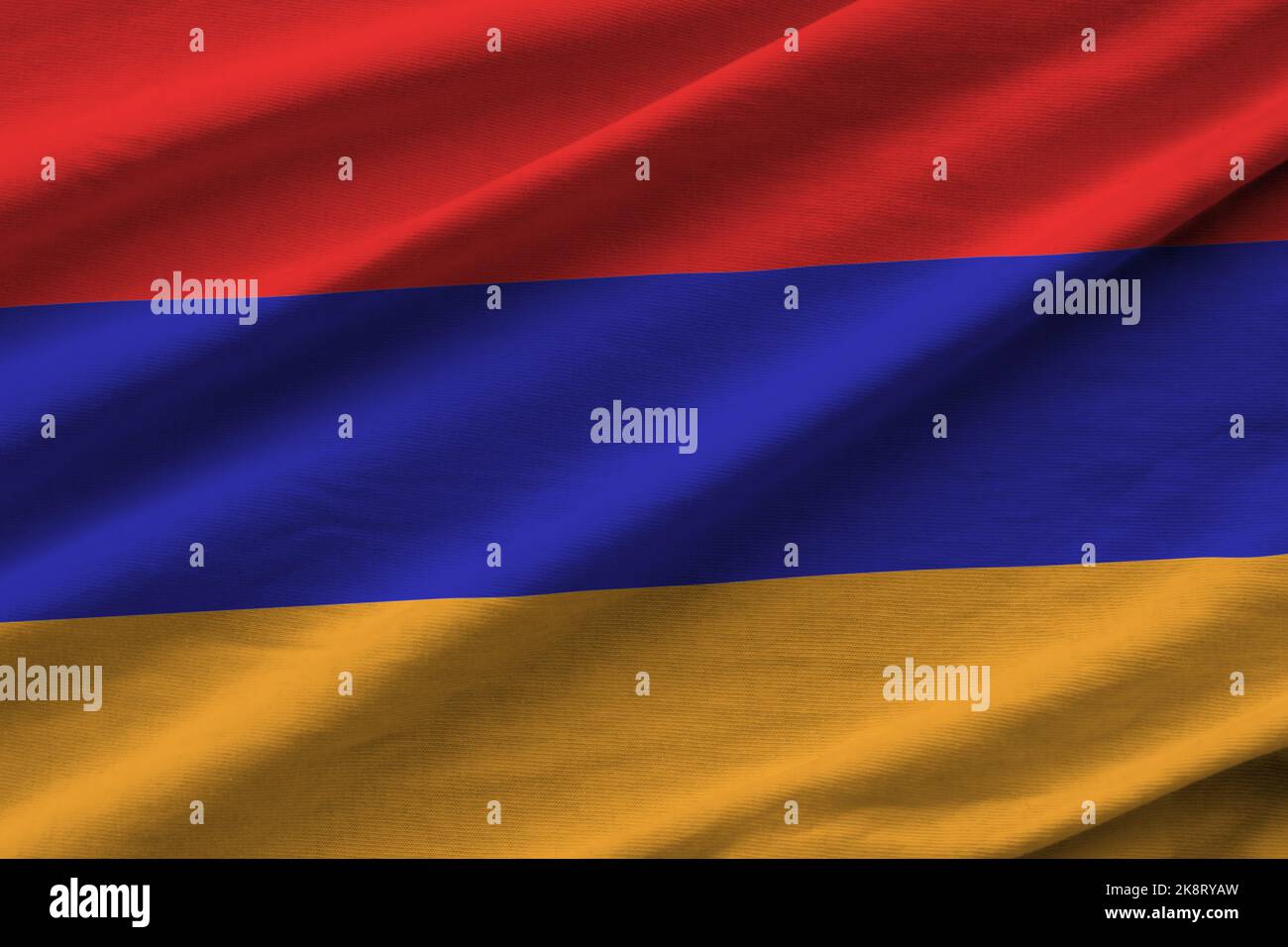 Armenia flag with big folds waving close up under the studio light ...