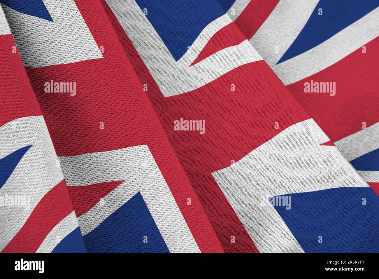 Great britain flag with big folds waving close up under the studio ...