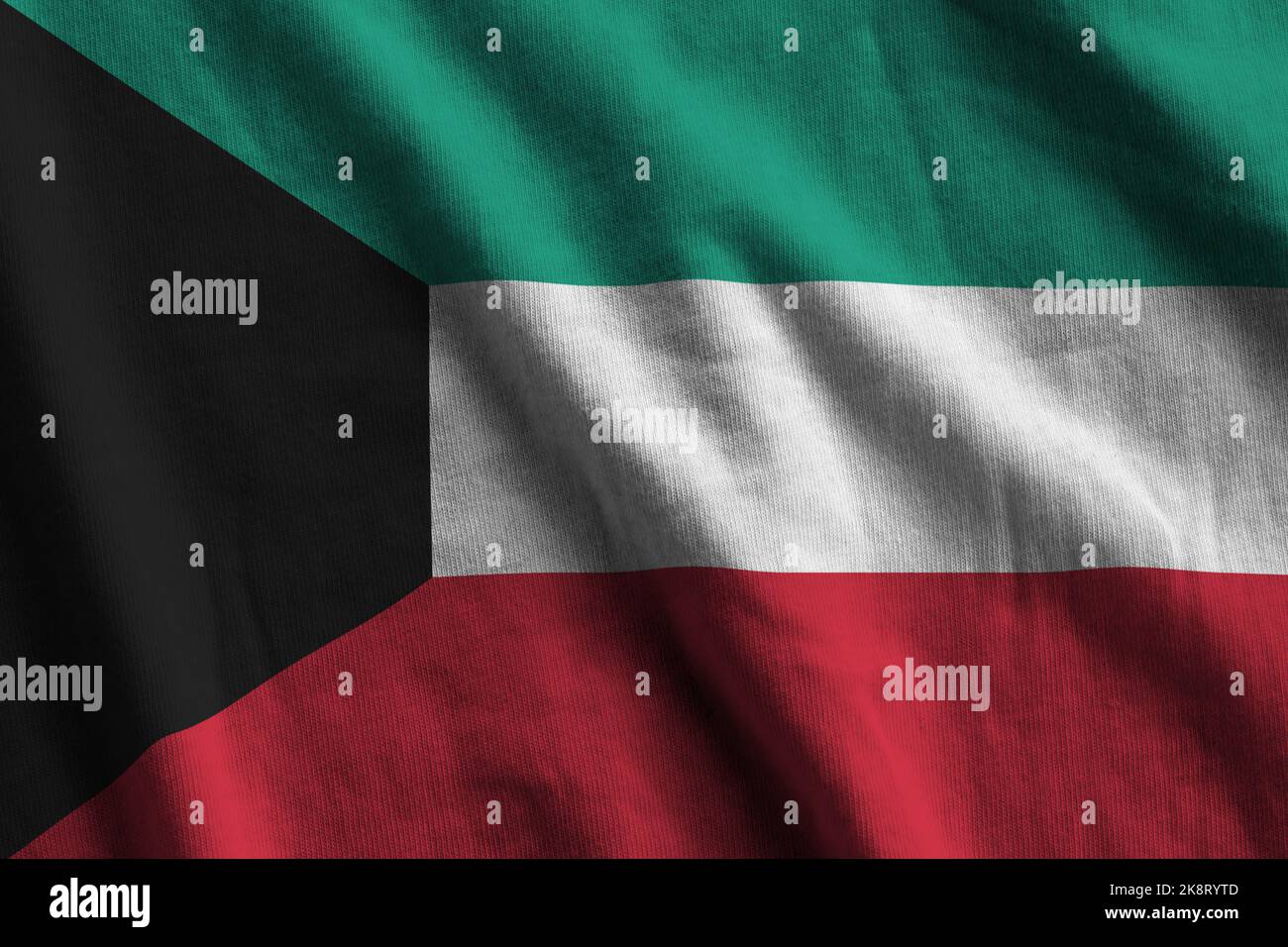 Kuwait flag with big folds waving close up under the studio light ...