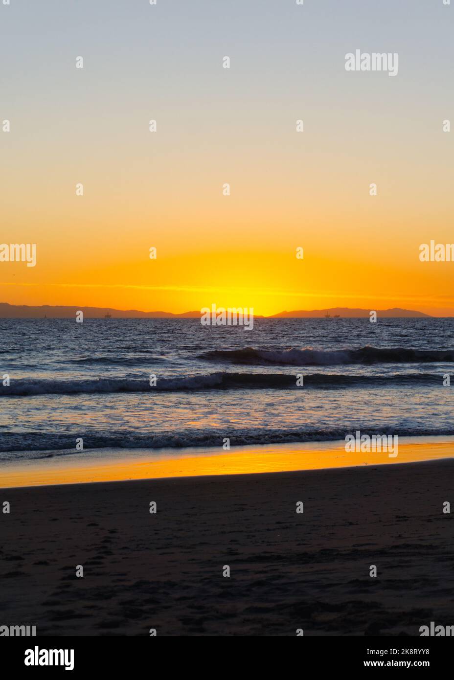California beach sunset with the silhouette of Catalina Island in the ...