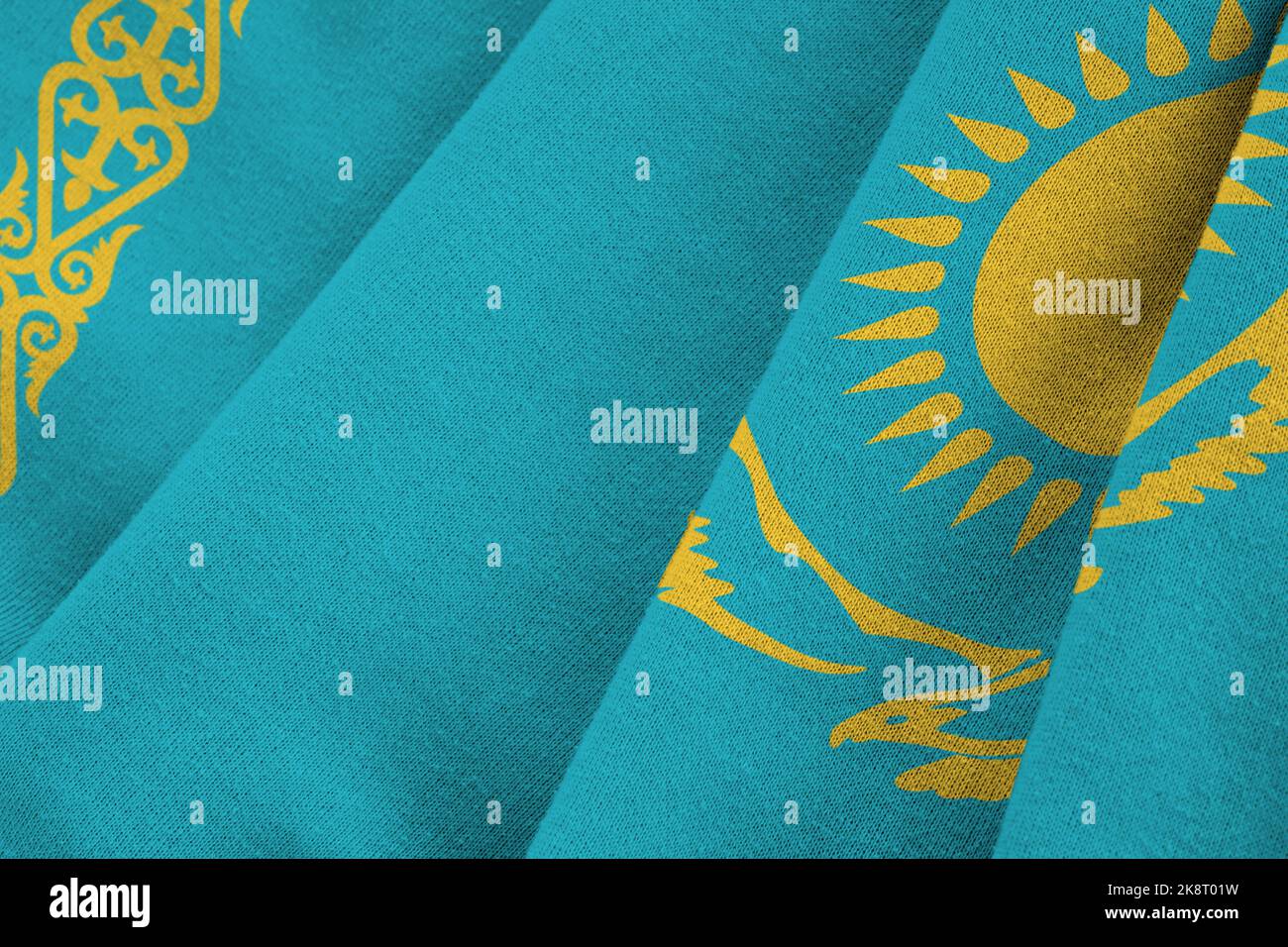 Kazakhstan flag with big folds waving close up under the studio light ...