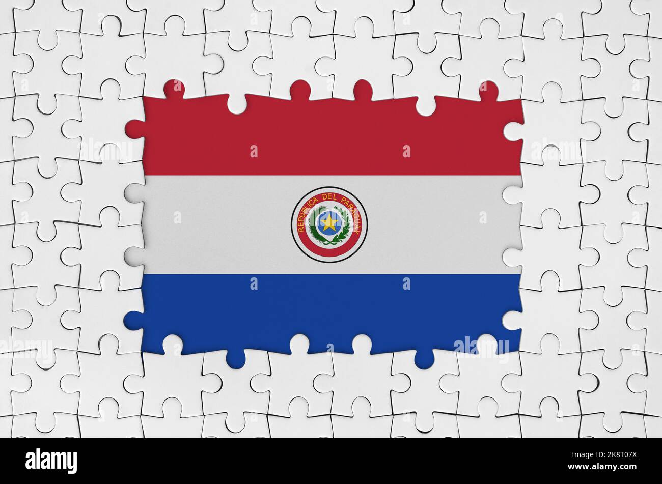 Paraguay flag in frame of white puzzle pieces with missing central ...
