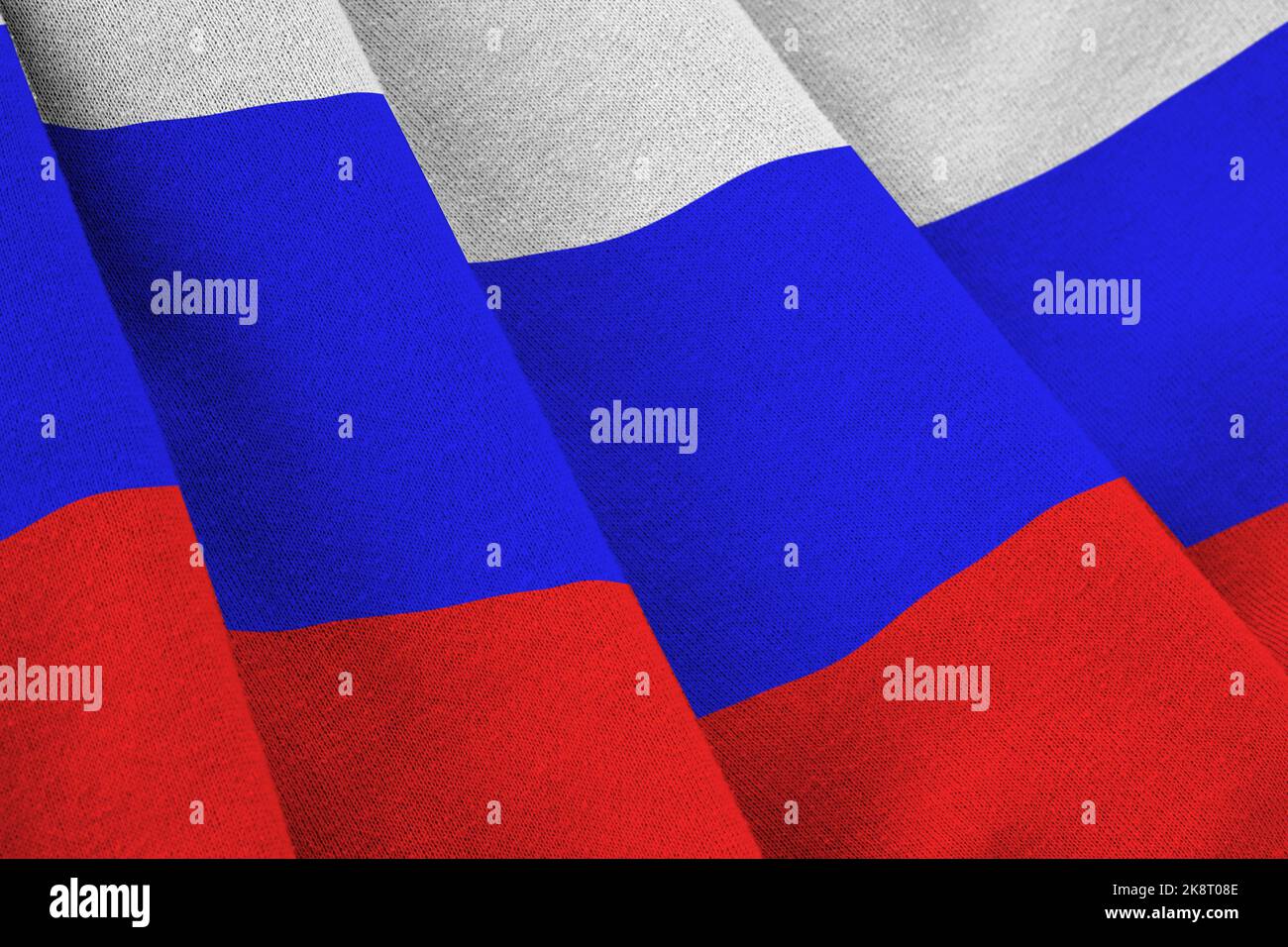 Russia flag with big folds waving close up under the studio light ...