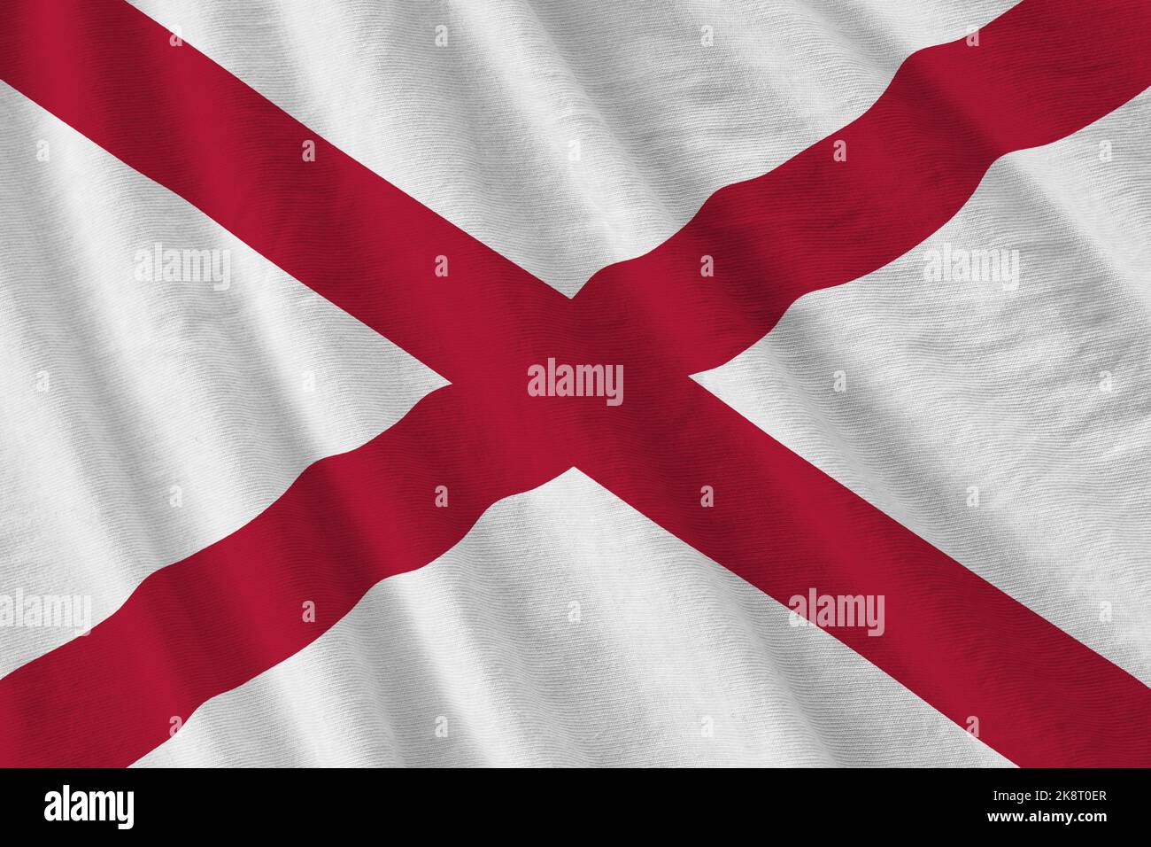 Alabama US state flag with big folds waving close up under the studio ...
