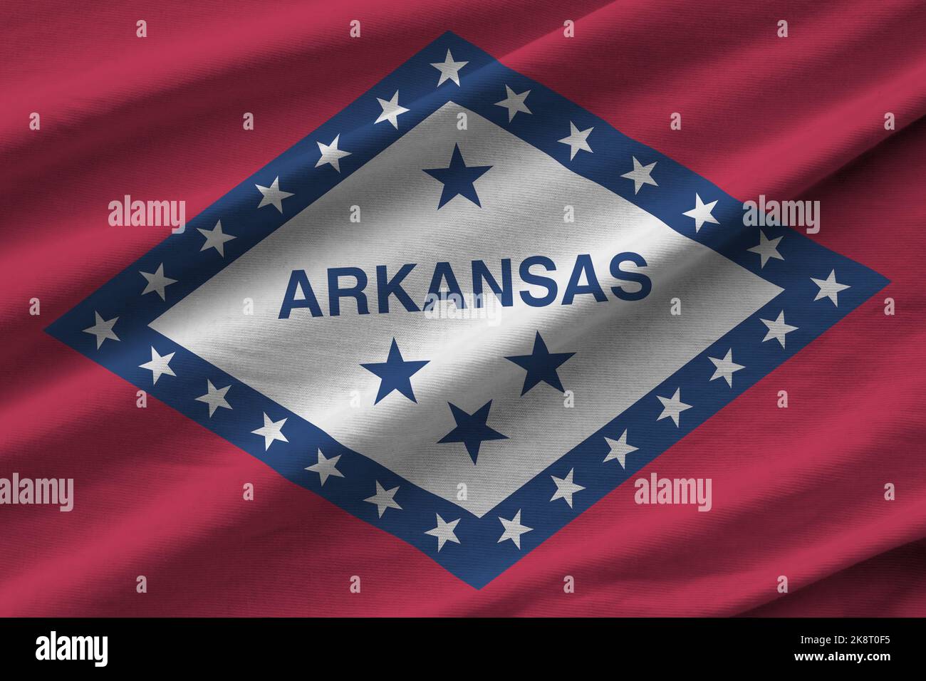 Arkansas US state flag with big folds waving close up under the studio ...