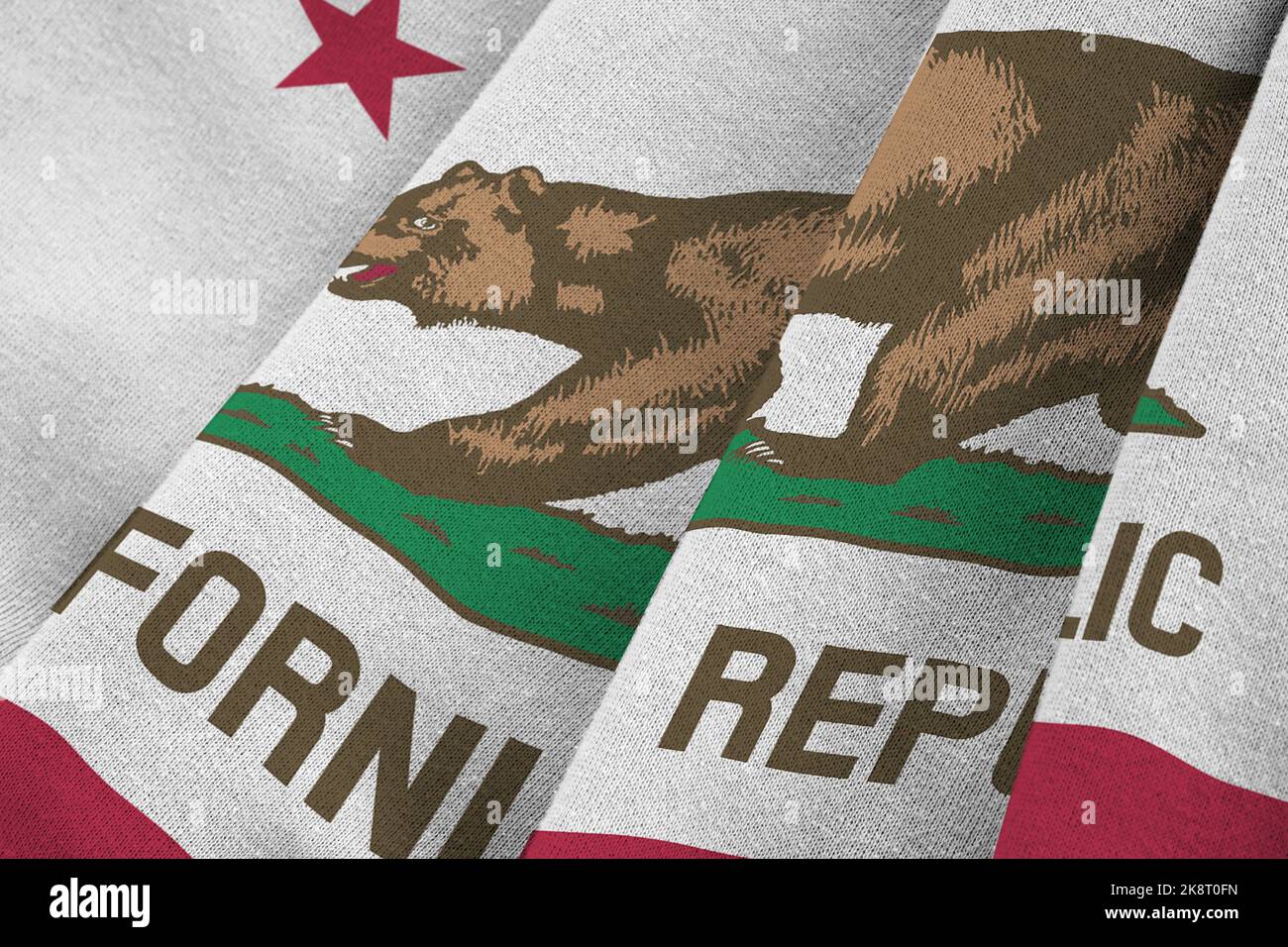 California US state flag with big folds waving close up under the ...