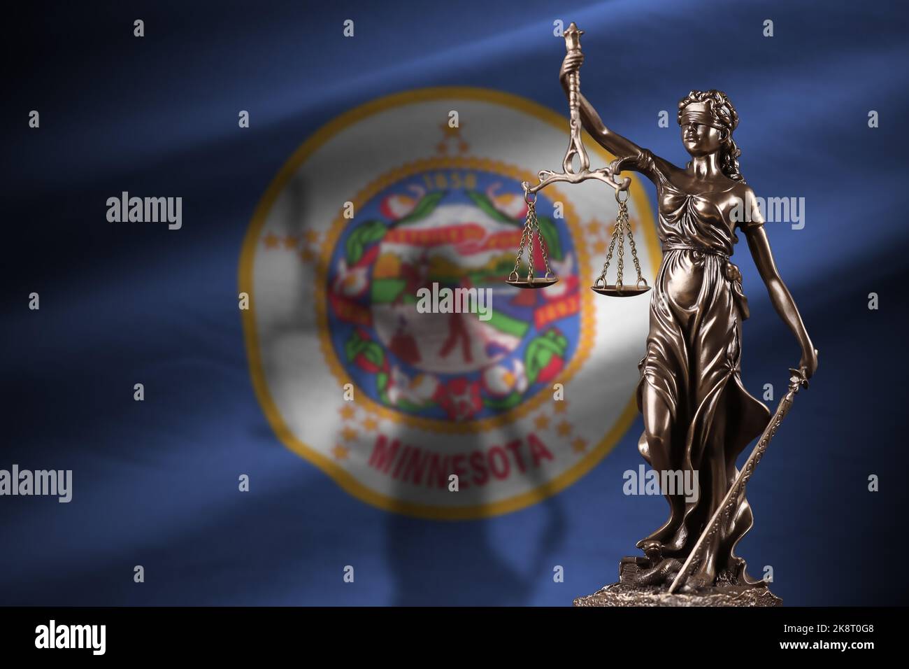 Minnesota US state flag with statue of lady justice and judicial scales ...