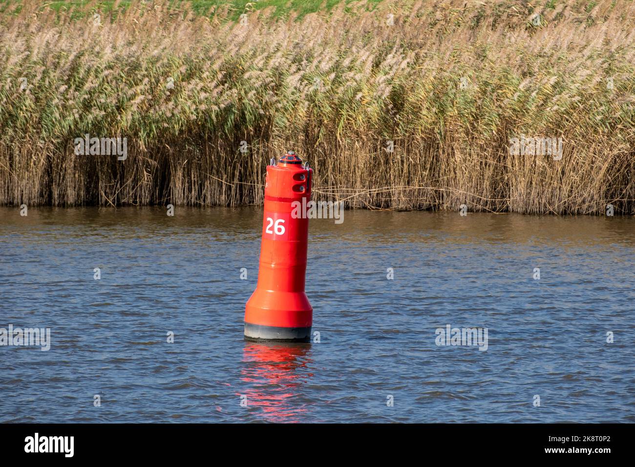 Red buoy to mark a split in a river in the Netherlands Stock Photo - Alamy