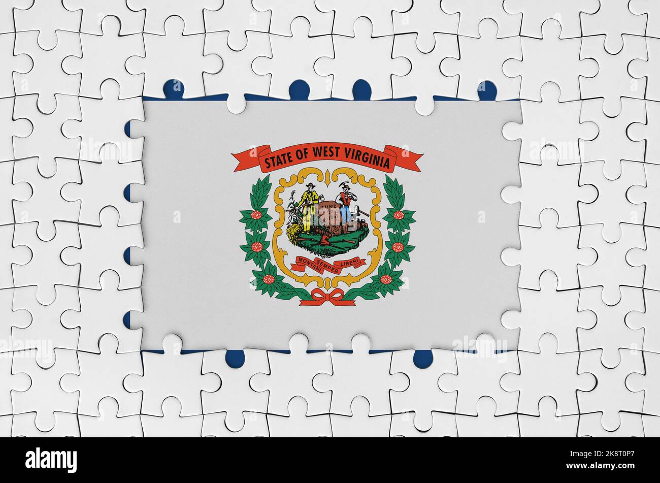 West Virginia US state flag in frame of white puzzle pieces with ...