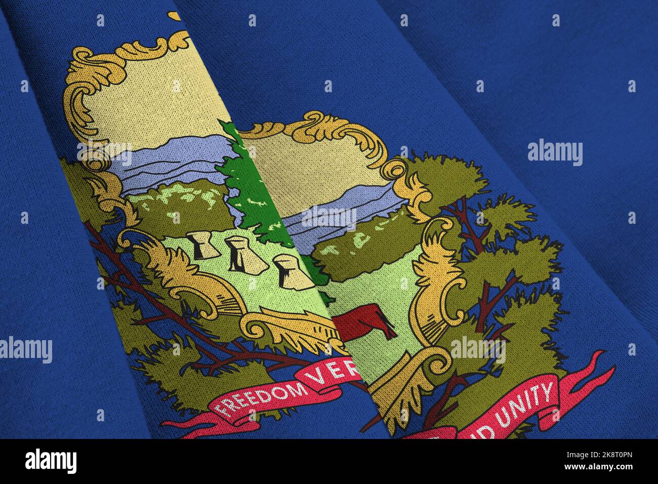 Vermont US state flag with big folds waving close up under the studio ...