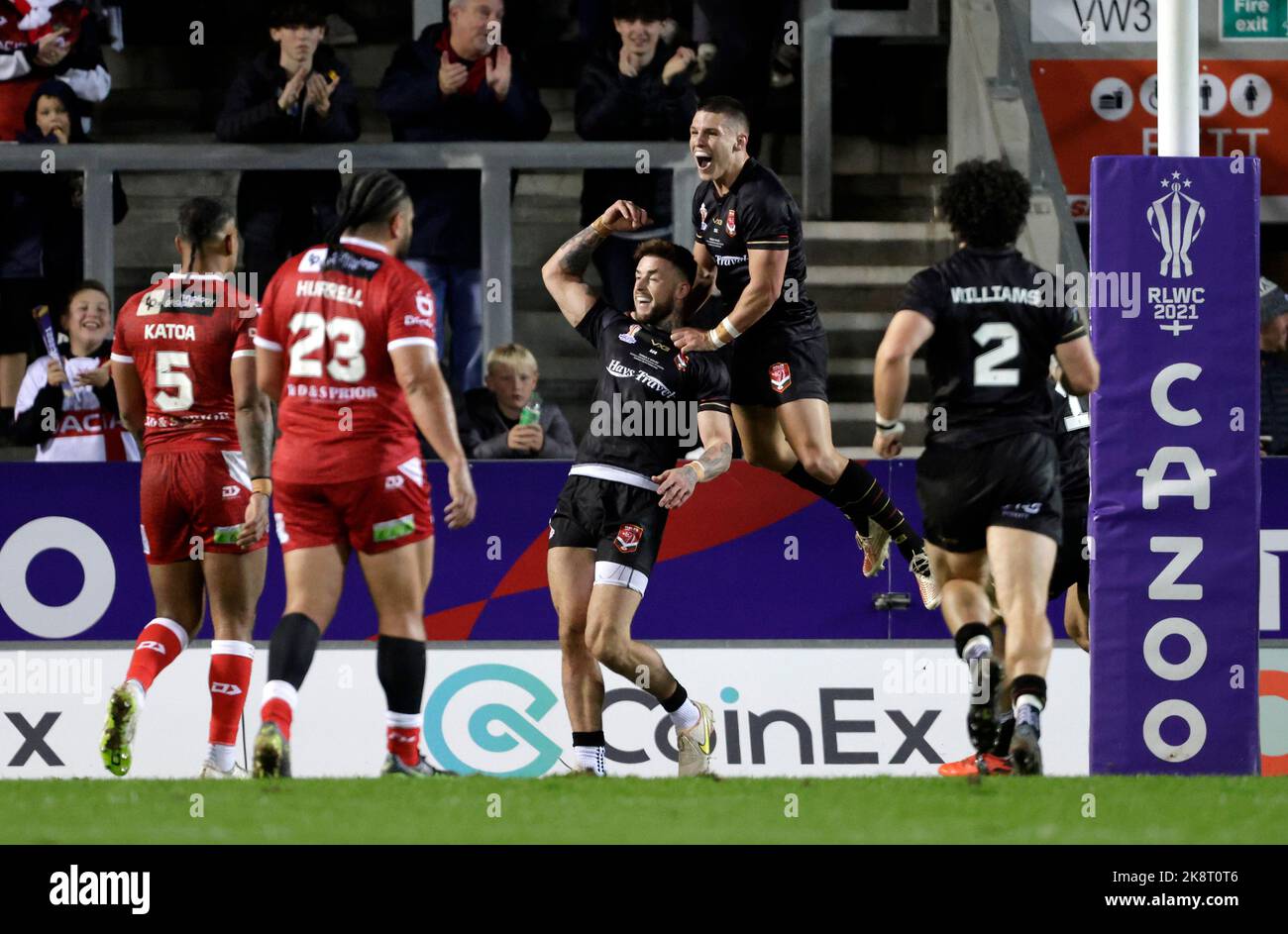 Wales' Kyle Evans (centre) celebrates scoring his side's first try of ...