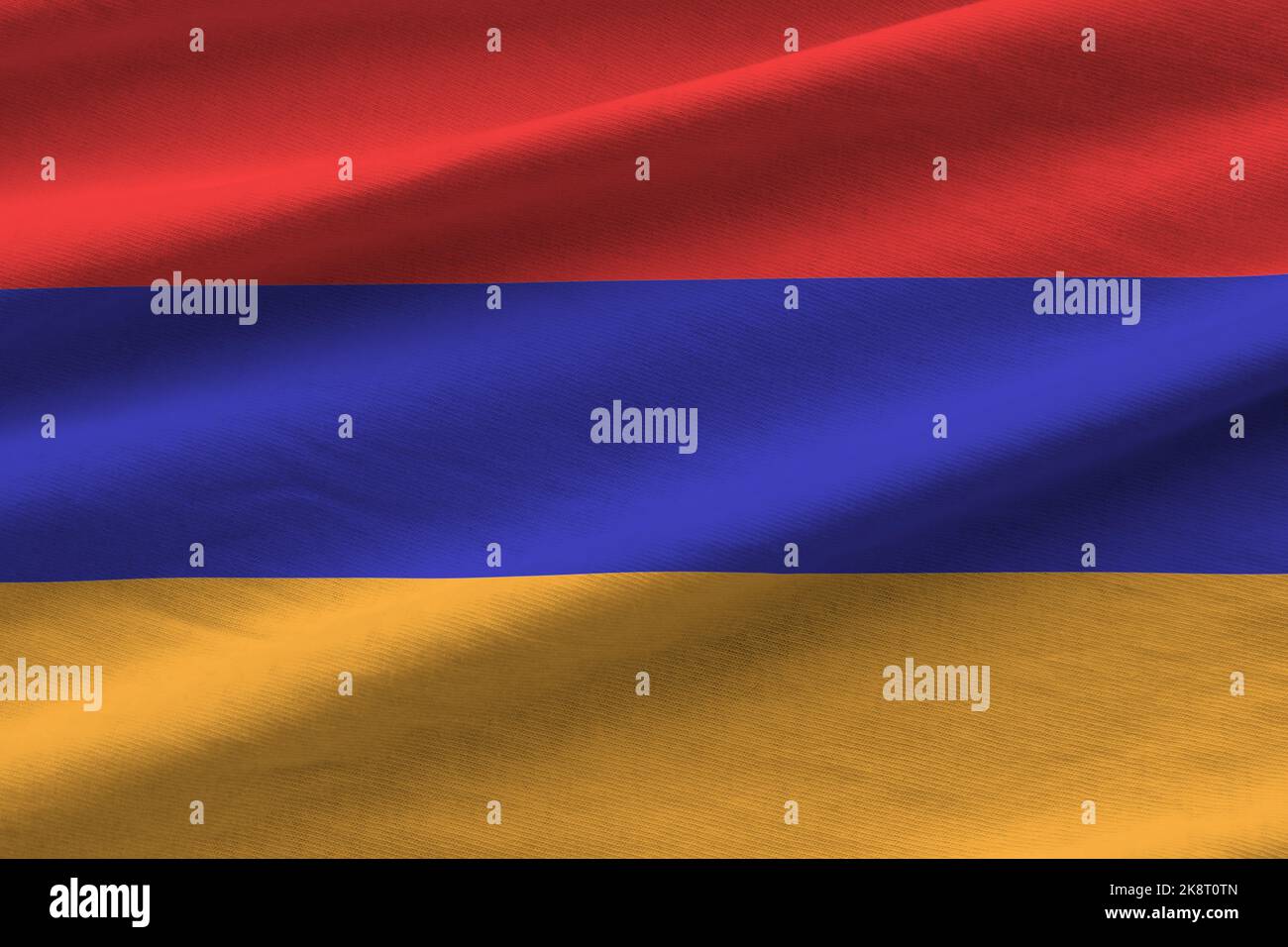 Armenia flag with big folds waving close up under the studio light ...