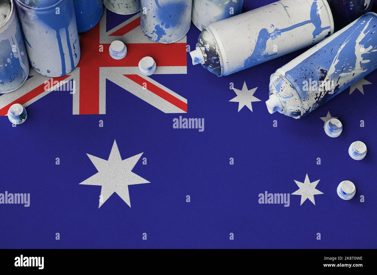 Australia flag and few used aerosol spray cans for graffiti painting ...
