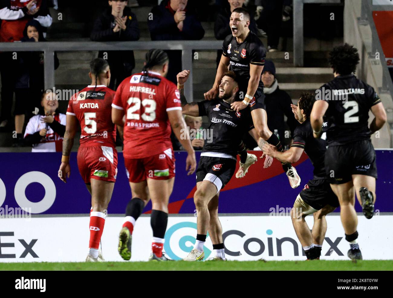 Wales' Kyle Evans (centre) celebrates scoring his side's first try of ...
