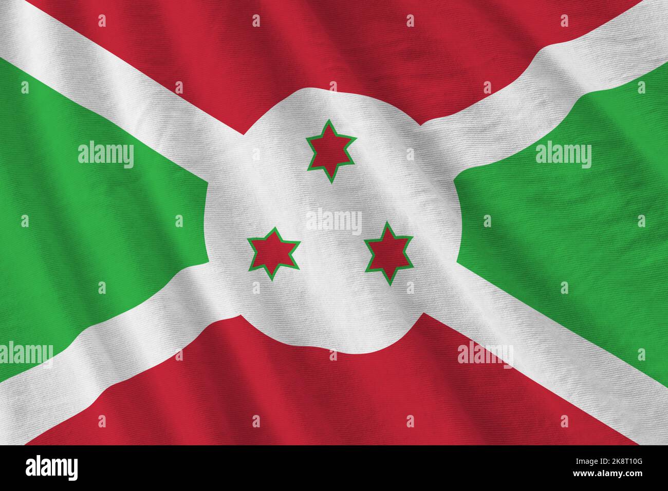 Burundi flag with big folds waving close up under the studio light ...