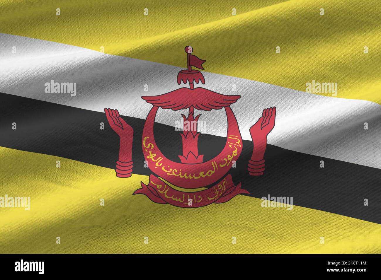 Brunei Darussalam flag with big folds waving close up under the studio ...