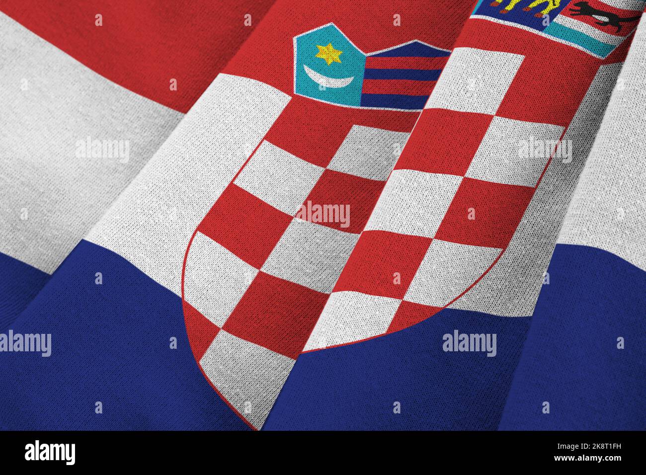 Croatia flag with big folds waving close up under the studio light ...