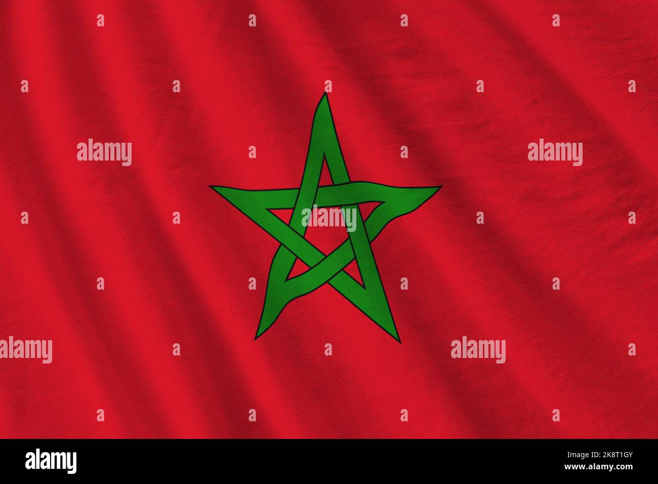 Morocco flag with big folds waving close up under the studio light ...