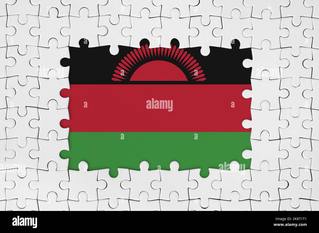 Malawi flag in frame of white puzzle pieces with missing central parts ...