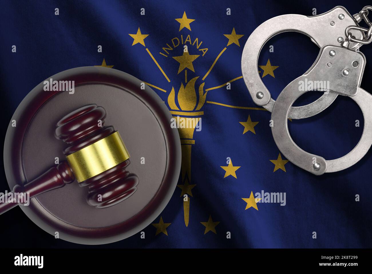 Indiana US state flag with judge mallet and handcuffs in dark room ...
