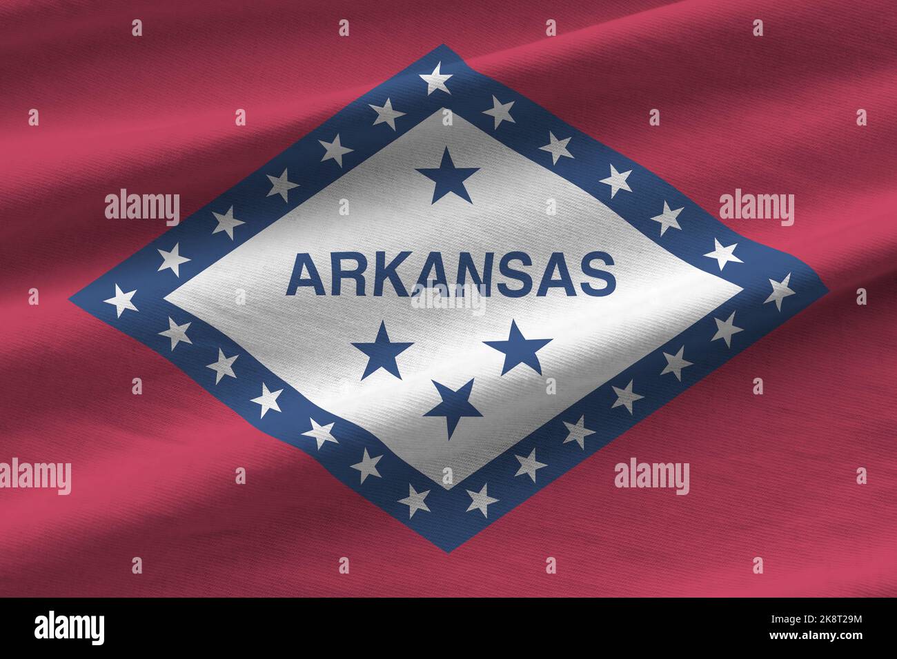 Arkansas US state flag with big folds waving close up under the studio ...