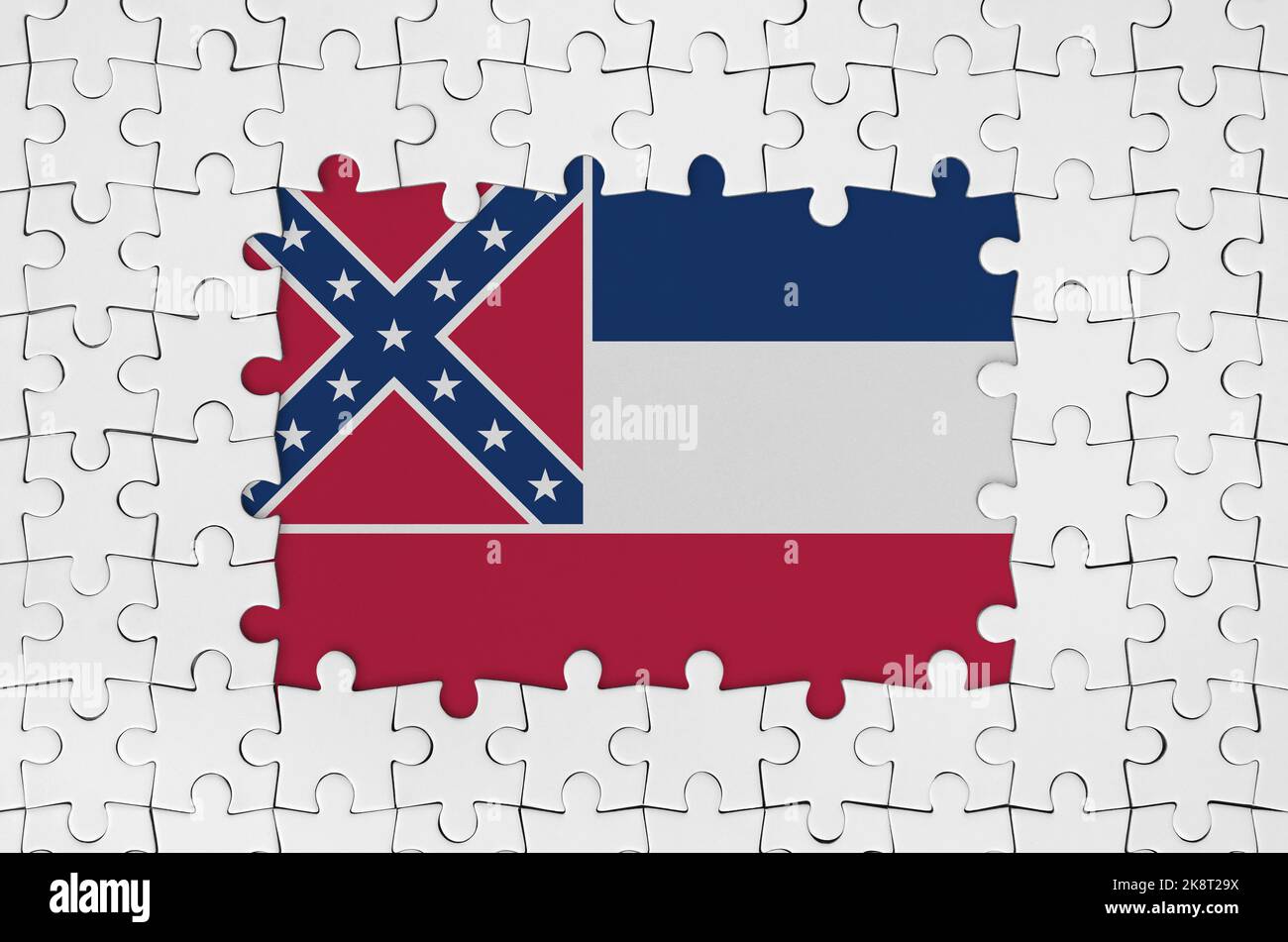 Mississippi new US state flag in frame of white puzzle pieces with ...