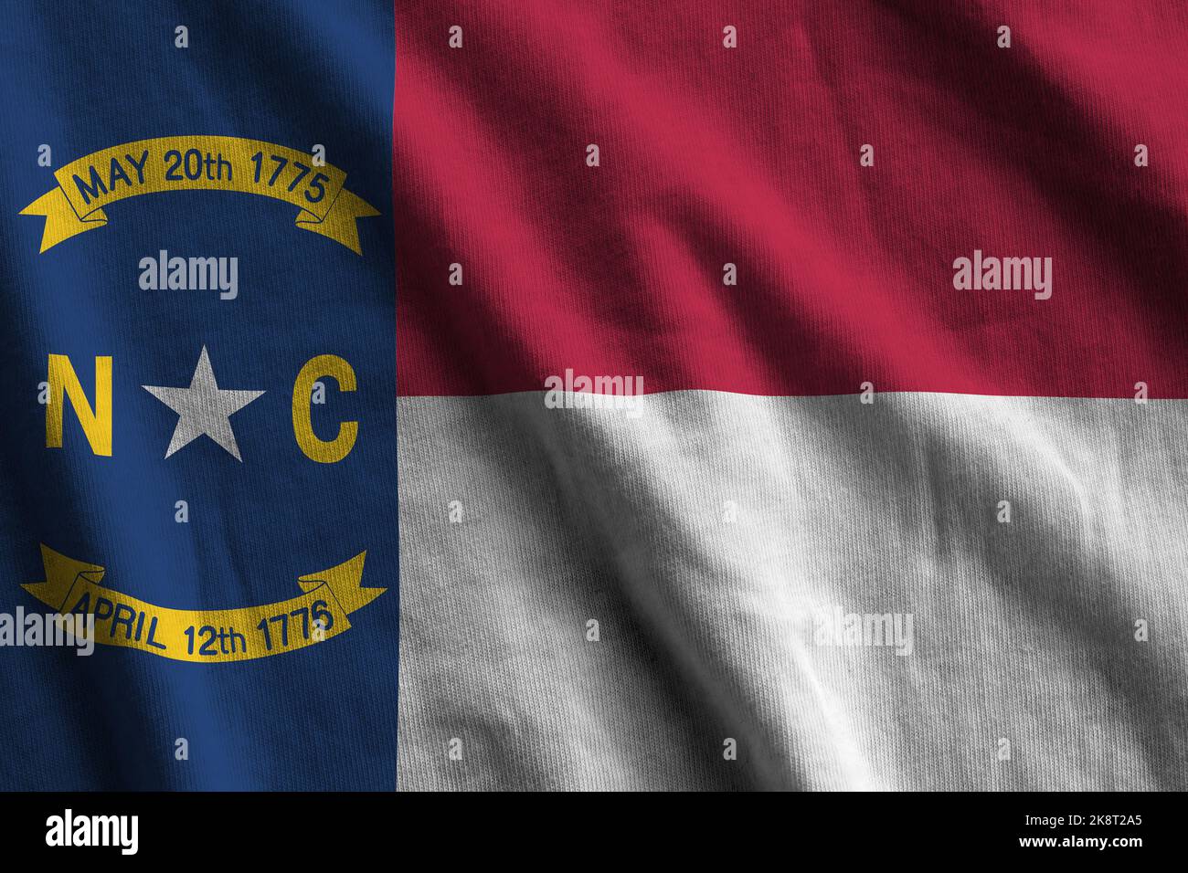 North Carolina US state flag with big folds waving close up under the ...