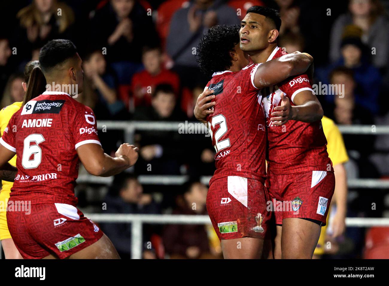 Tonga's Daniel Tupou (right) celebrates scoring his side's first try of ...