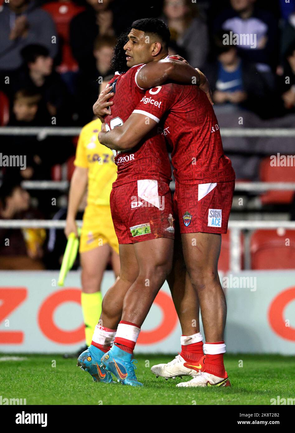 Tonga's Daniel Tupou (right) celebrates scoring his side's first try of ...