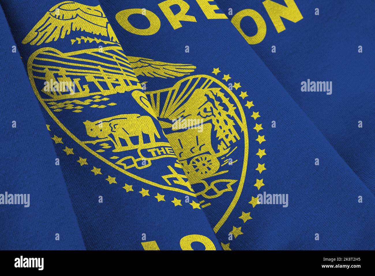 Oregon US state flag with big folds waving close up under the studio ...