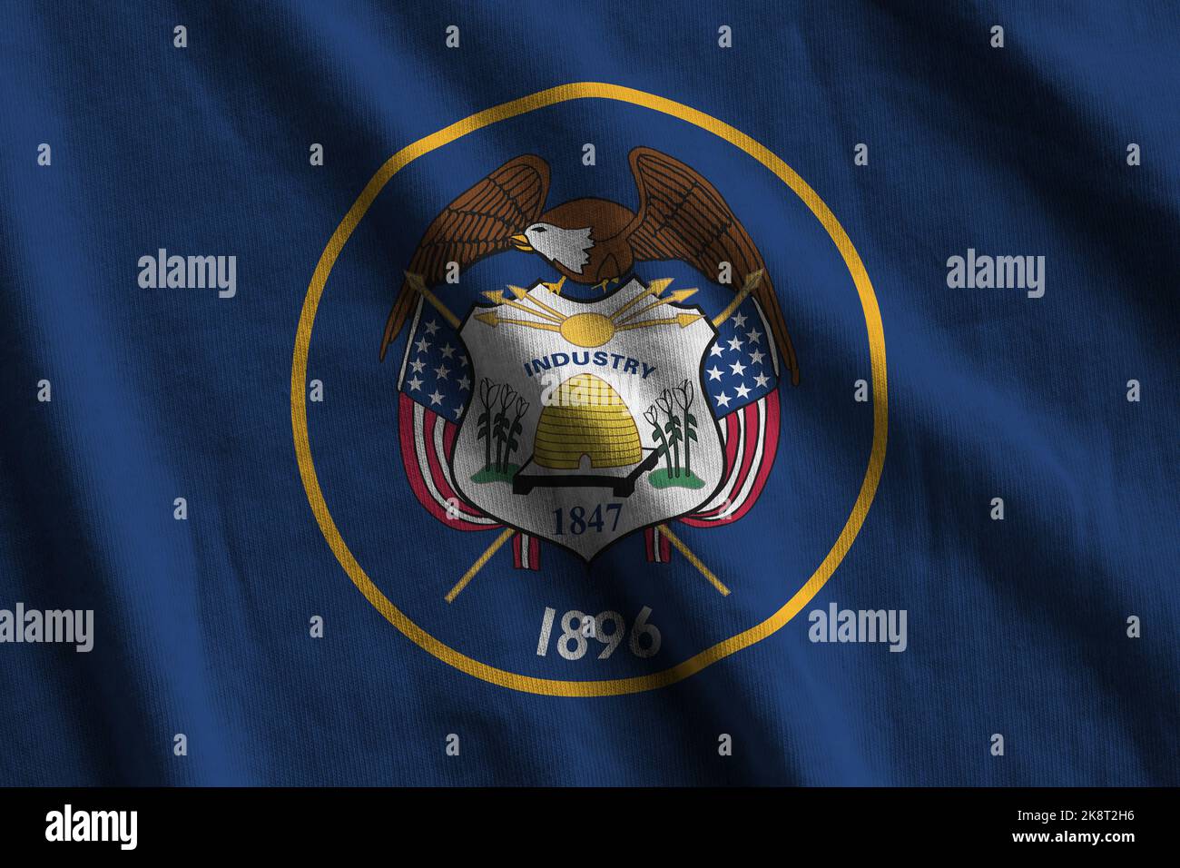 Utah US state flag with big folds waving close up under the studio ...
