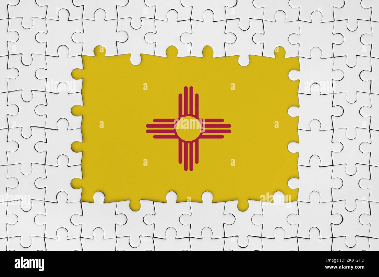 New Mexico US state flag in frame of white puzzle pieces with missing ...