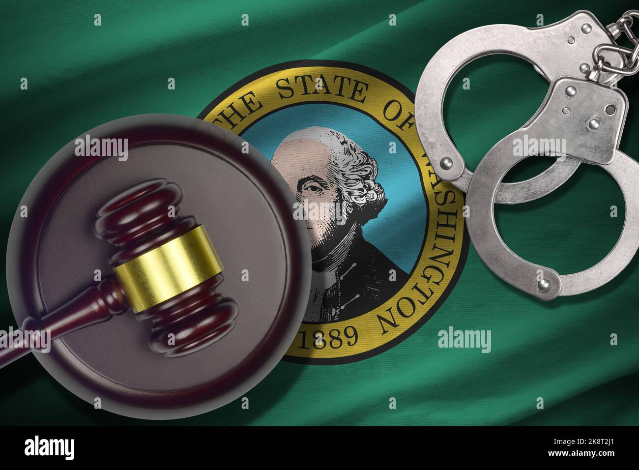 Washington US state flag with judge mallet and handcuffs in dark room ...