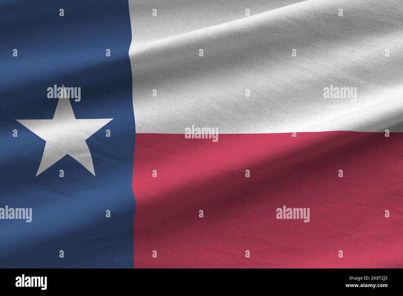 Texas US state flag with big folds waving close up under the studio ...