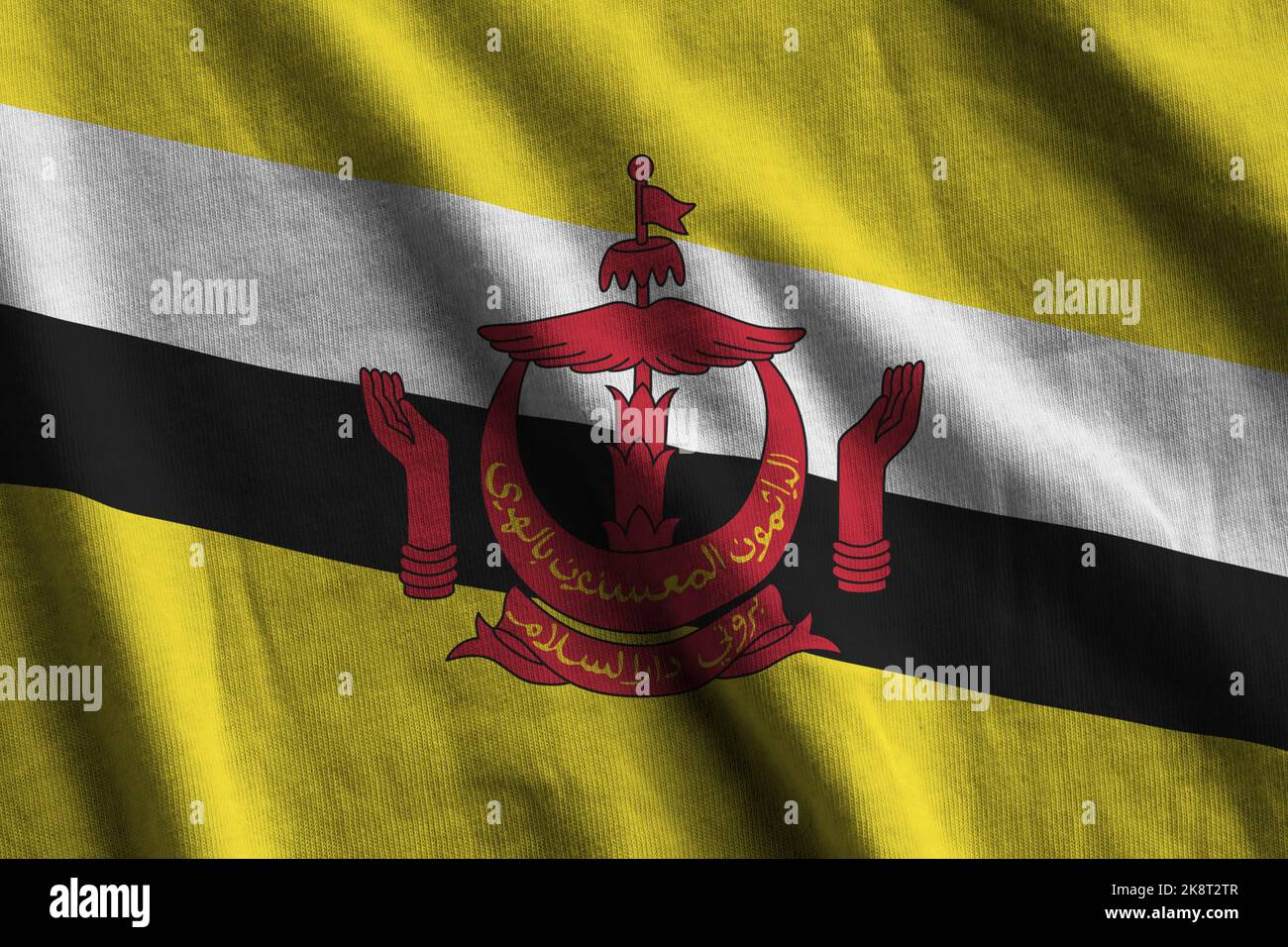 Brunei Darussalam flag with big folds waving close up under the studio ...