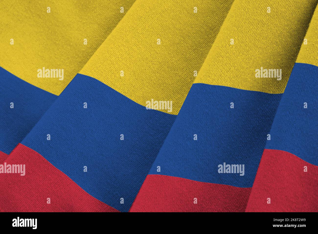 Colombia flag with big folds waving close up under the studio light ...