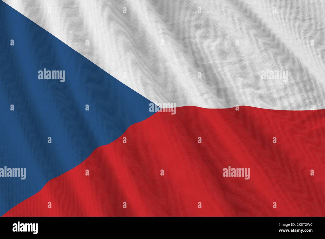 Czech flag with big folds waving close up under the studio light ...