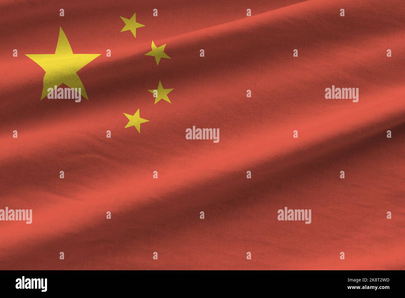 China flag with big folds waving close up under the studio light ...
