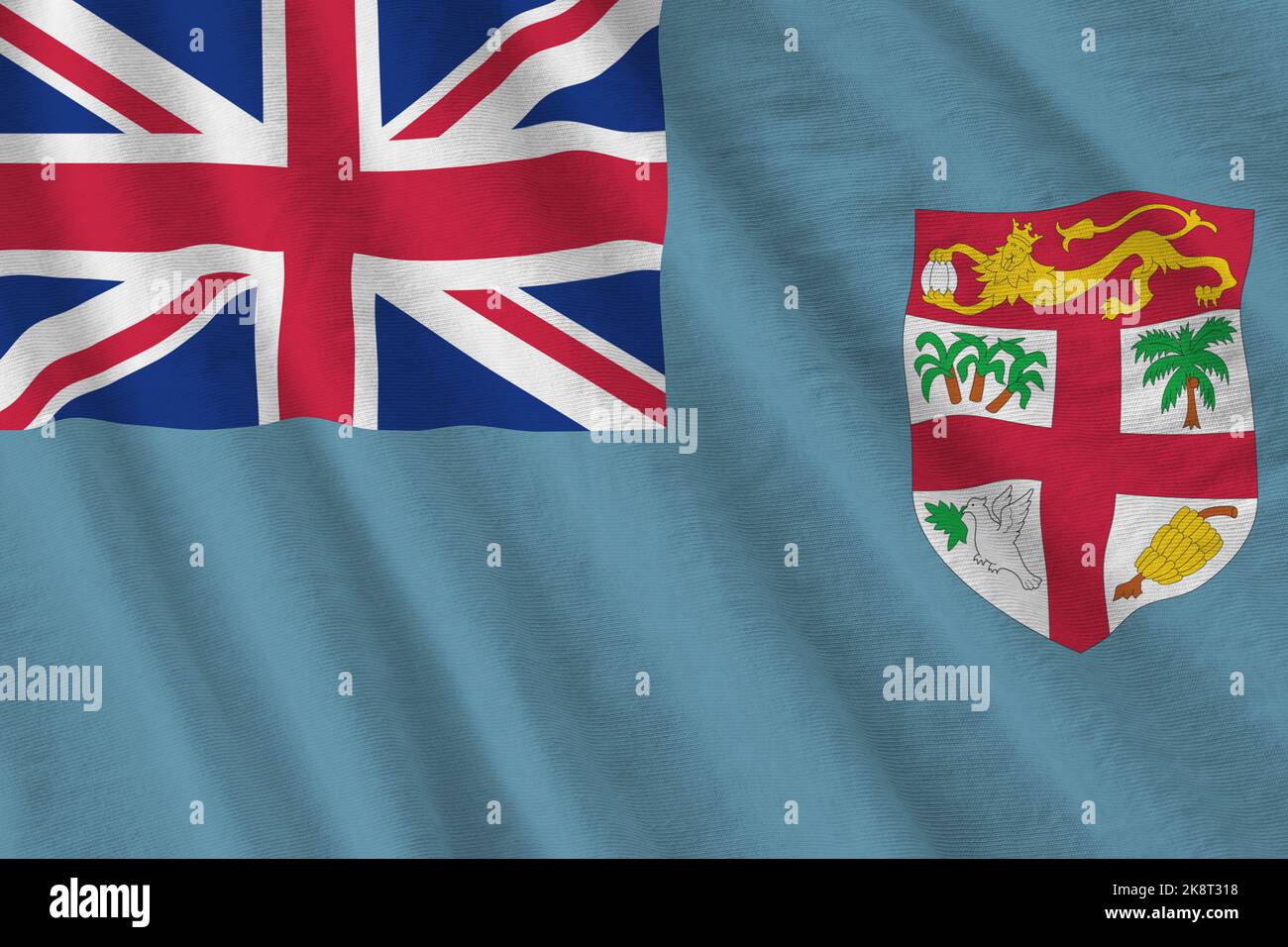 Fiji flag with big folds waving close up under the studio light indoors ...