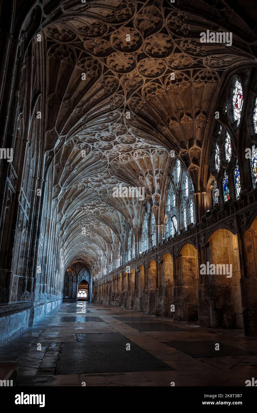 A vertical shot of the Gloucester Cathedral Cloisters with gothic ...