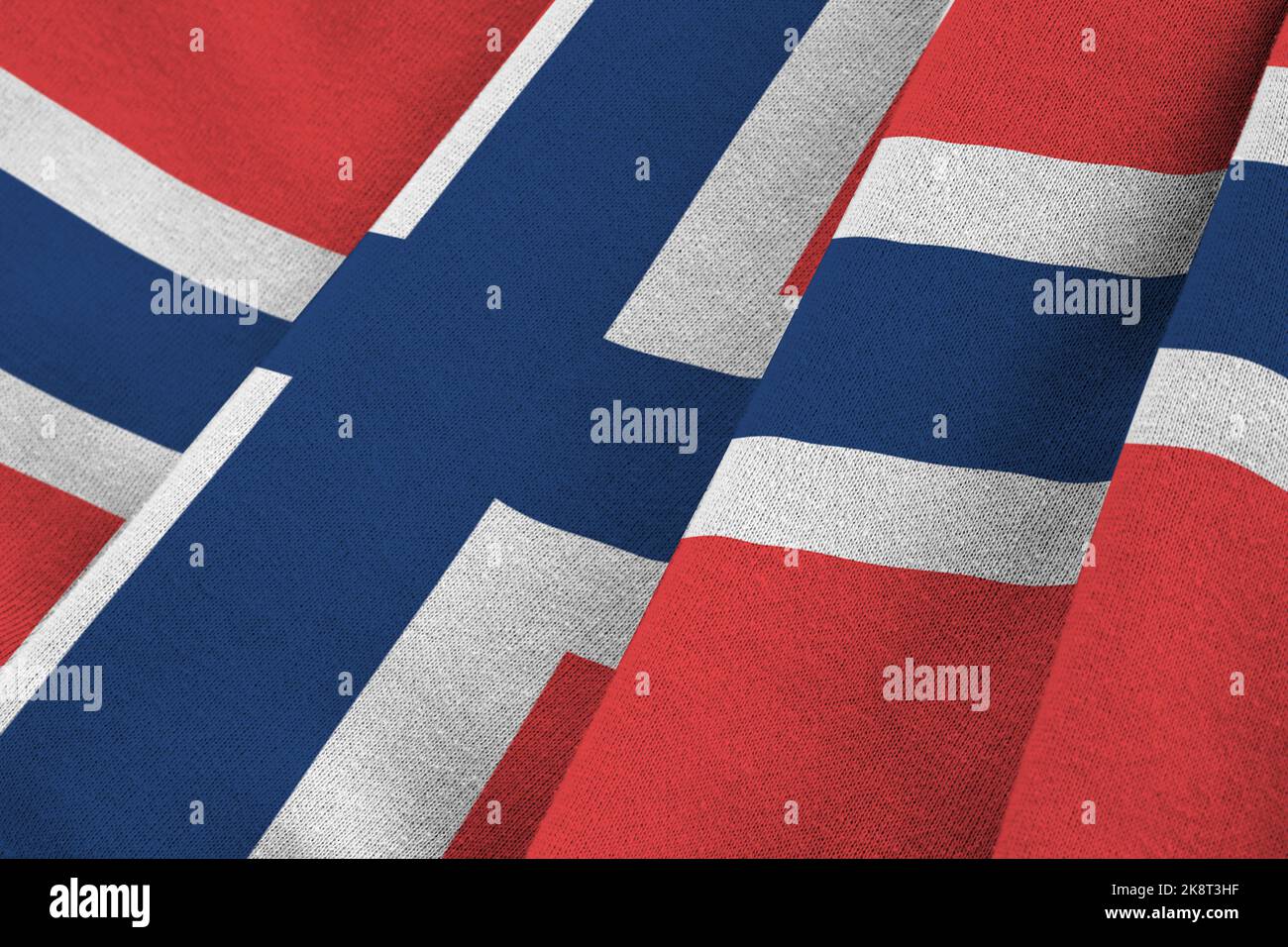 Norway flag with big folds waving close up under the studio light ...